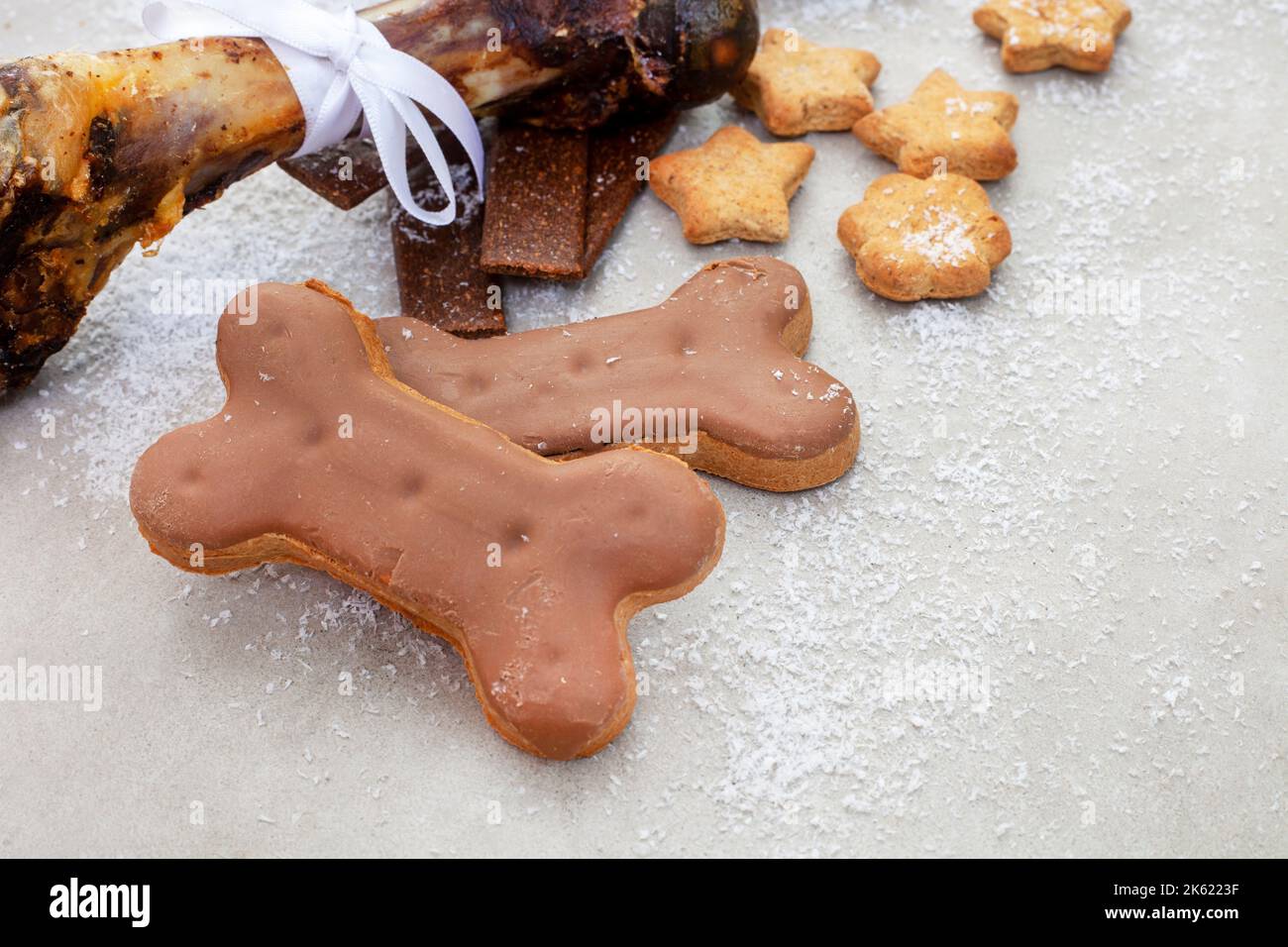 Dog treats flat lay on grey with imitation snow and copy space, rustic ...