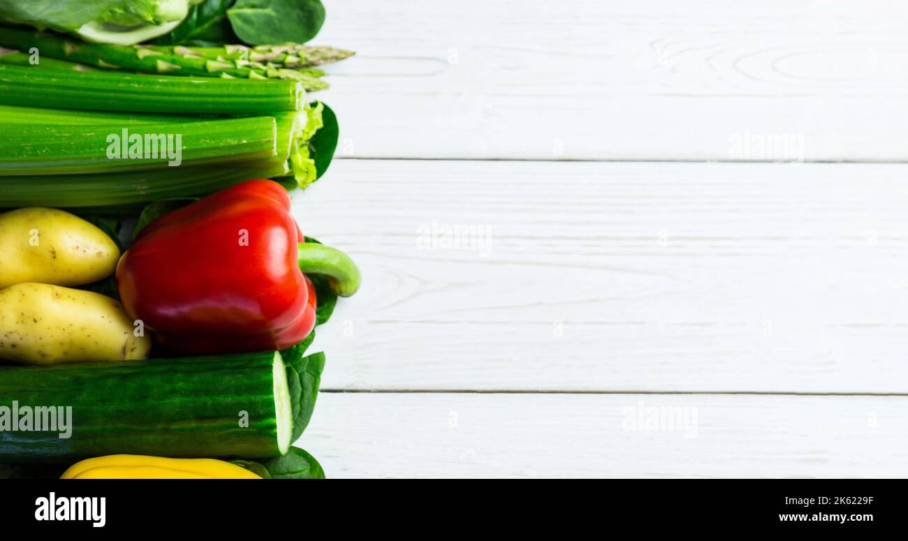 Directly above shot of various fresh raw vegetables arranged over ...