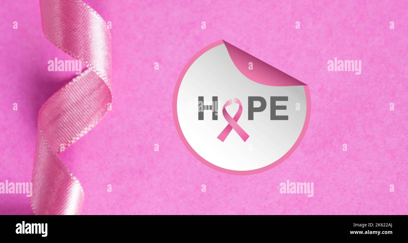 Composite of hope text in peeling circular sticker with pink awareness ...