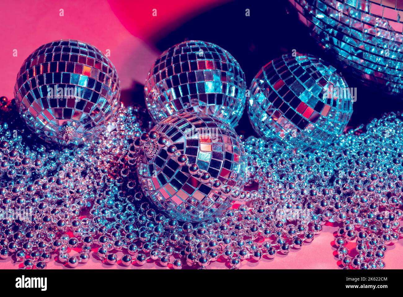 disco balls for decorationof a party on pink background Stock Photo - Alamy