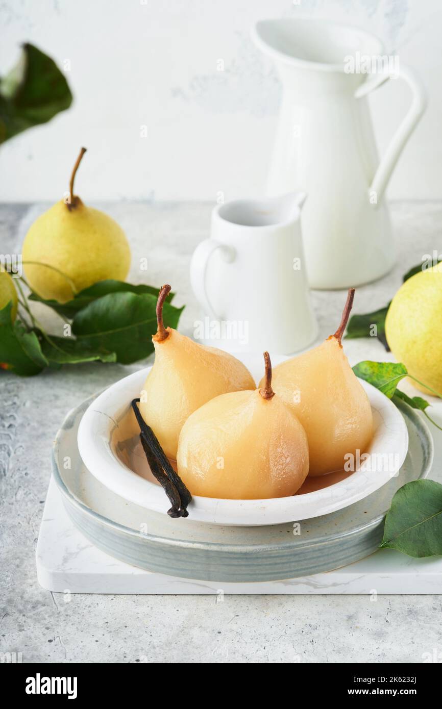 Pears. Poached pears in syrup. Traditional dessert sliced server in a ...