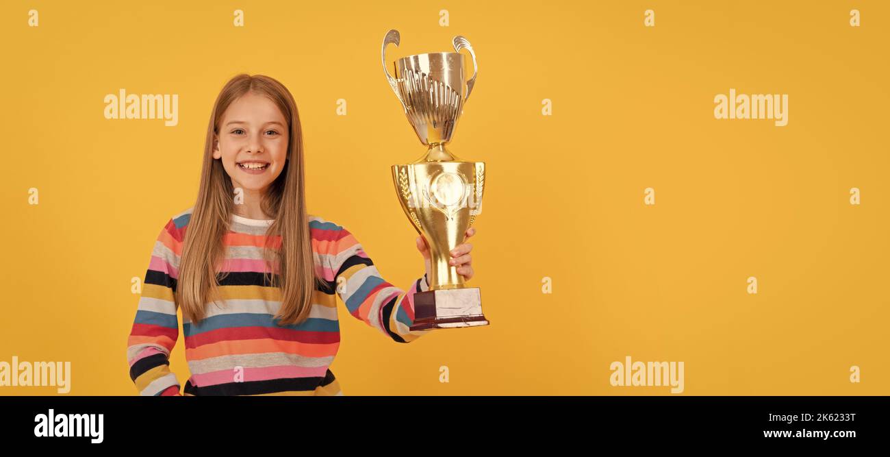 Happy child hold golden cup. achievement award. Celebrating school ...