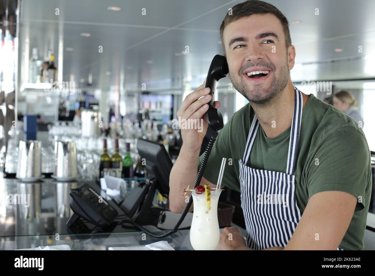 Restaurant worker taking a reservation on landline telephone Stock ...