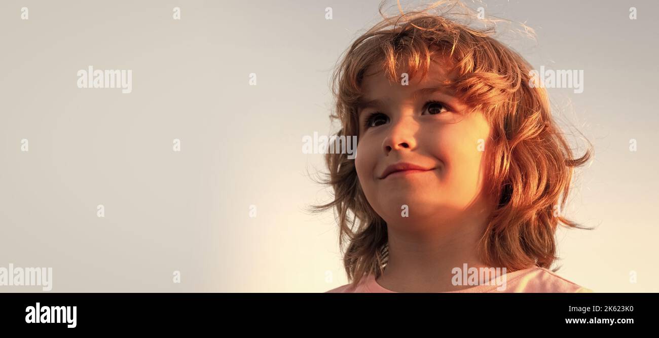 Face of happy boy child smiling sky background, portrait. Horizontal ...