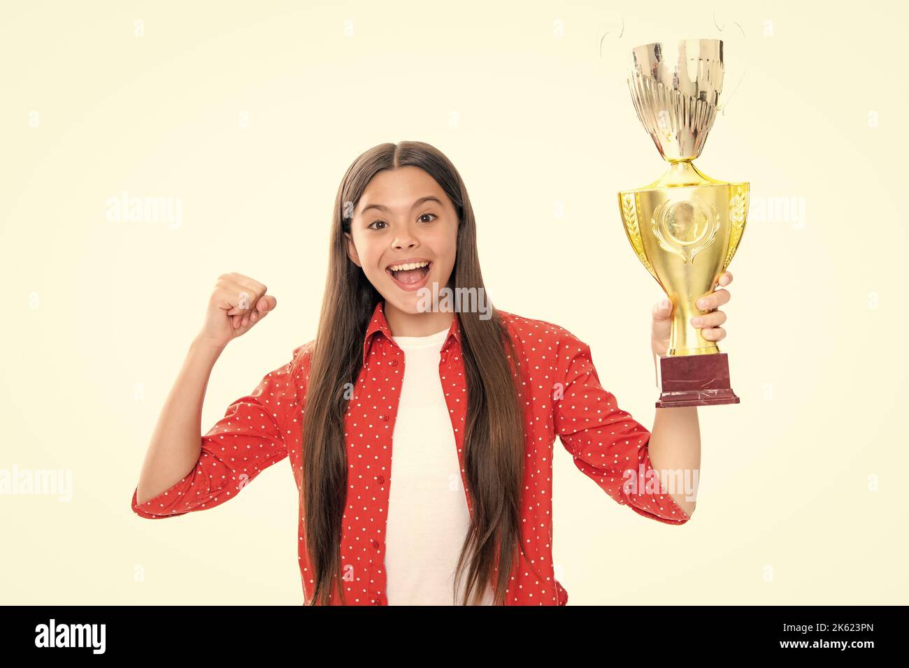 Teenage girl with win cup. Teen holding a trophy. Kid winner child won ...