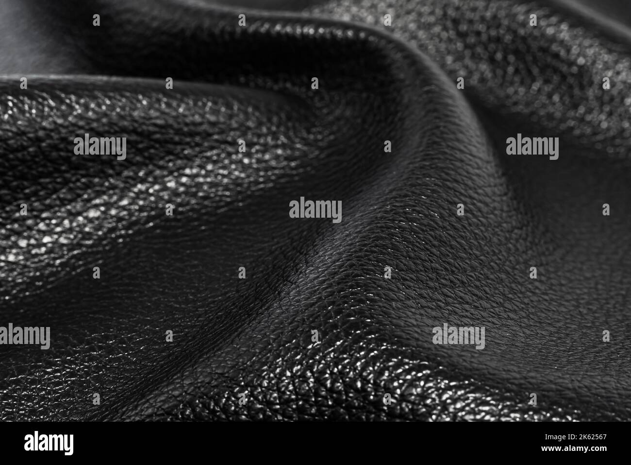 Black leather texture. Abstract background of dark leather with small ...