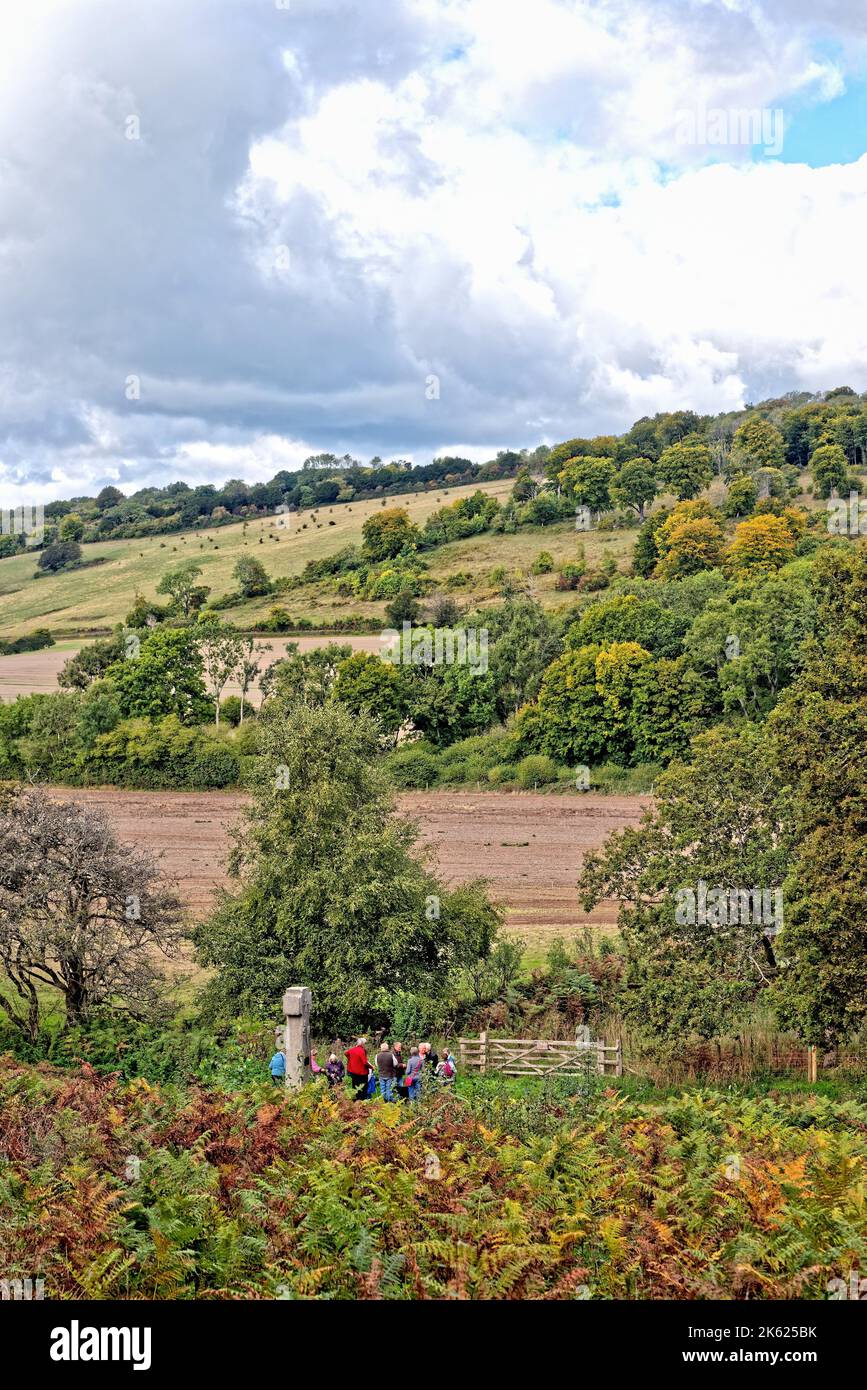 A group of elderly walkers standing by the Samuel Wilberforce memorial ...
