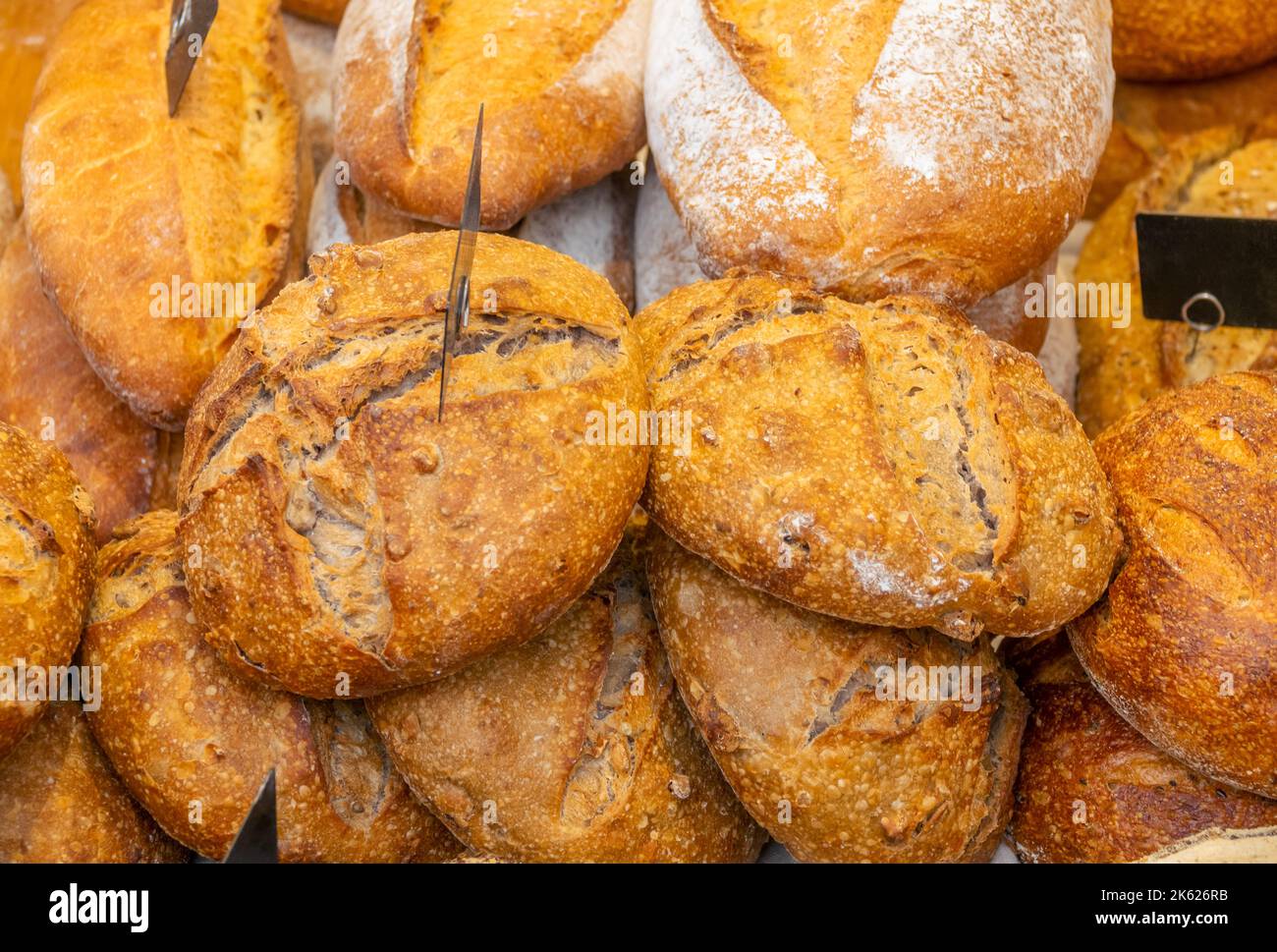 Netherlands. Farmers market in Amsterdam. Many loaves of breads close ...