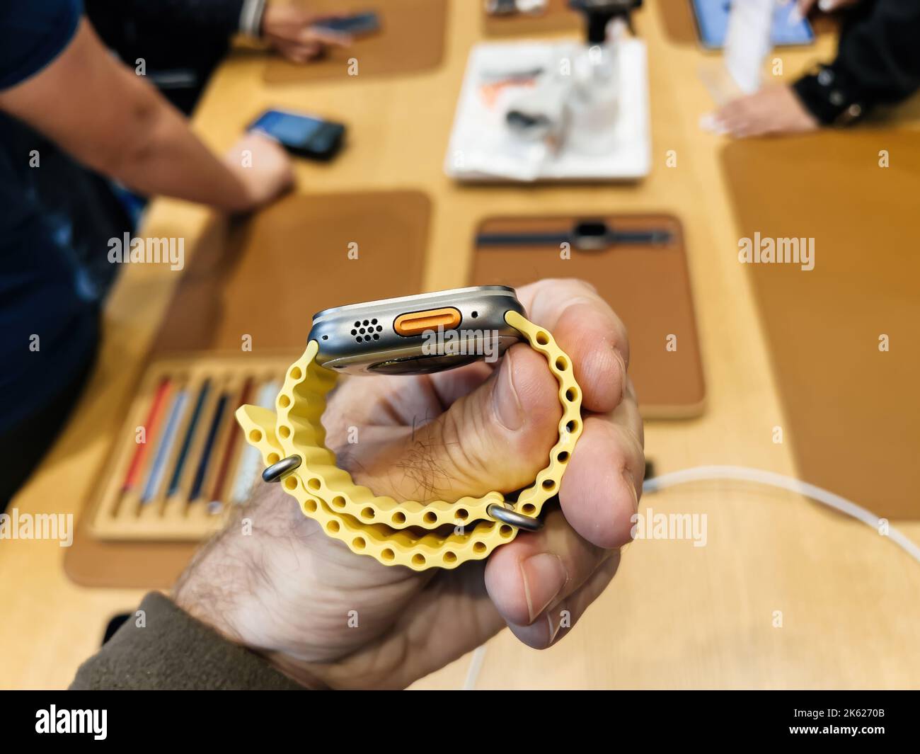 Paris, France - Sep 23, 2022: POV male hand holding ew titanium Apple ...