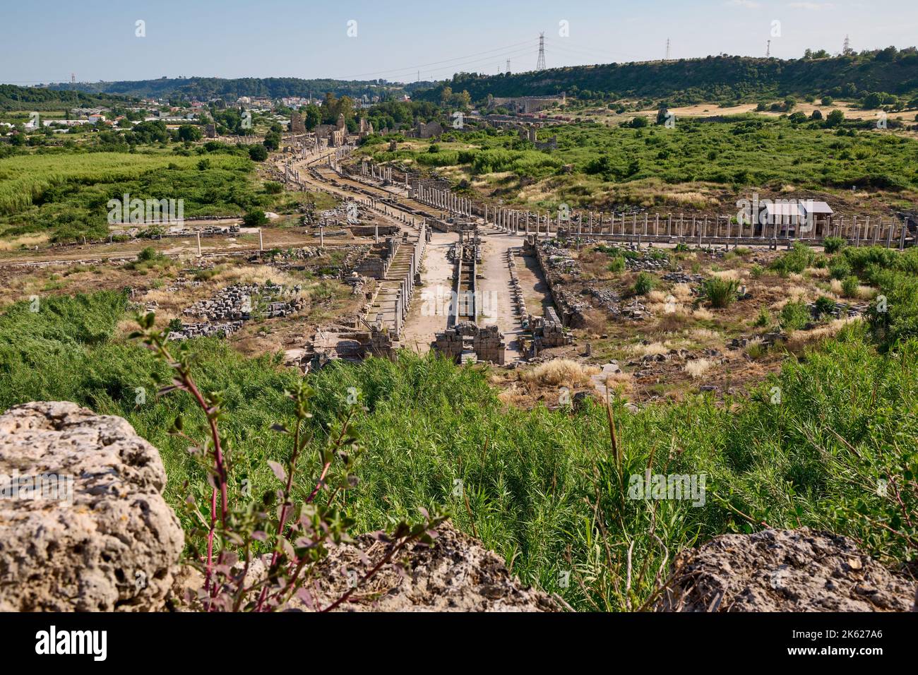 Aerial of columned street in the ruins of the Roman city of Perge ...