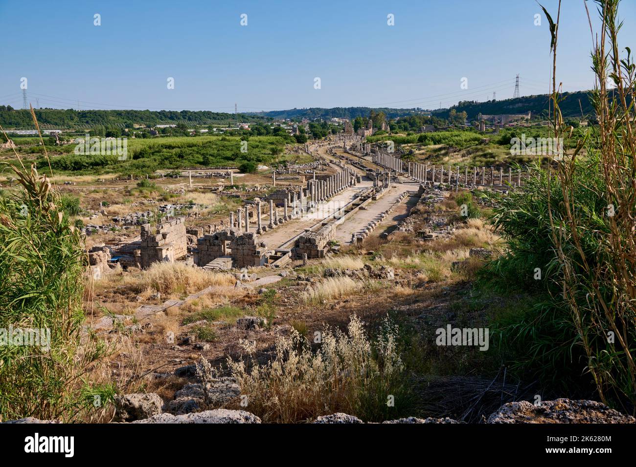 Aerial of columned street in the ruins of the Roman city of Perge ...