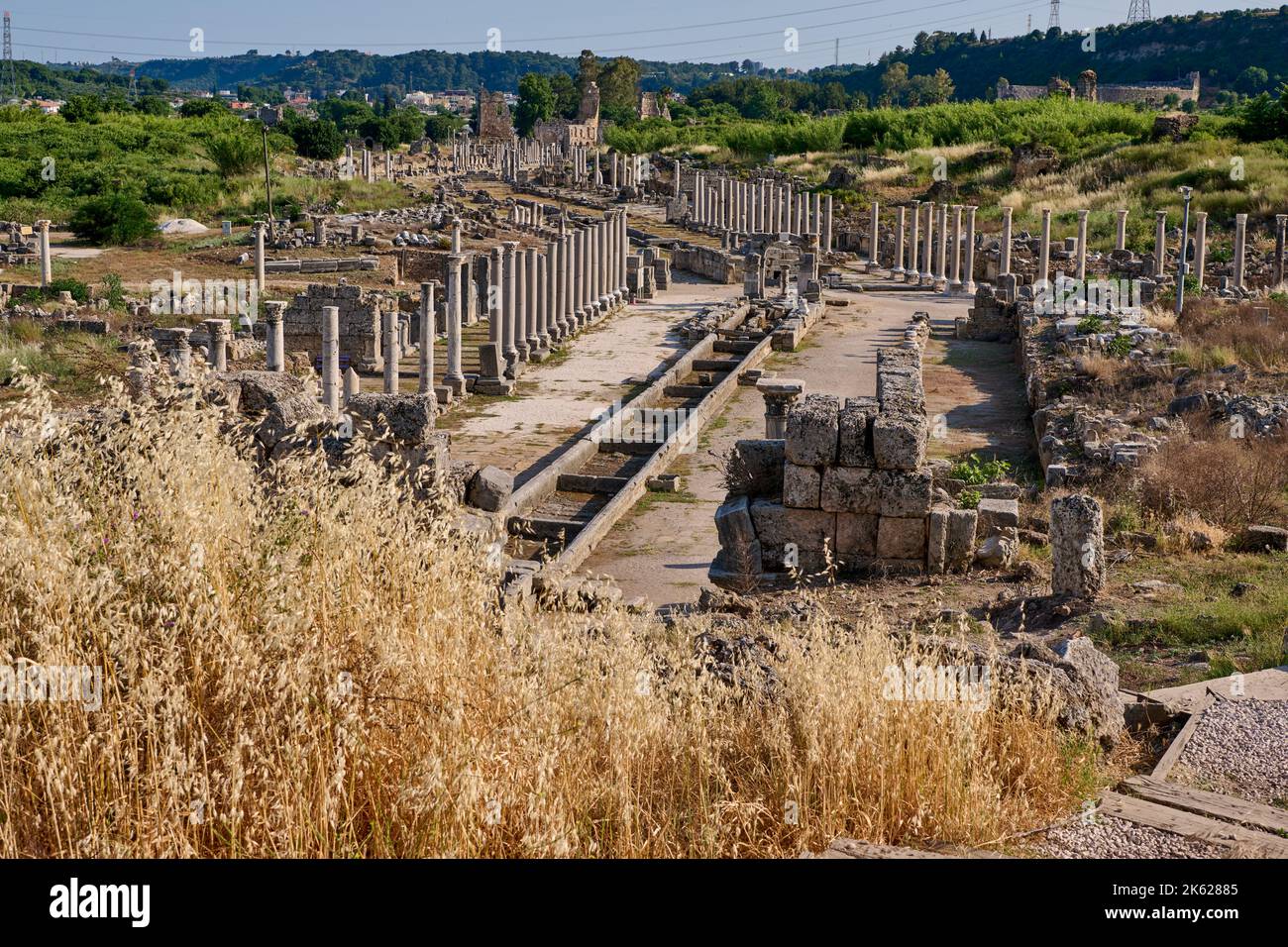 Aerial of columned street in the ruins of the Roman city of Perge ...
