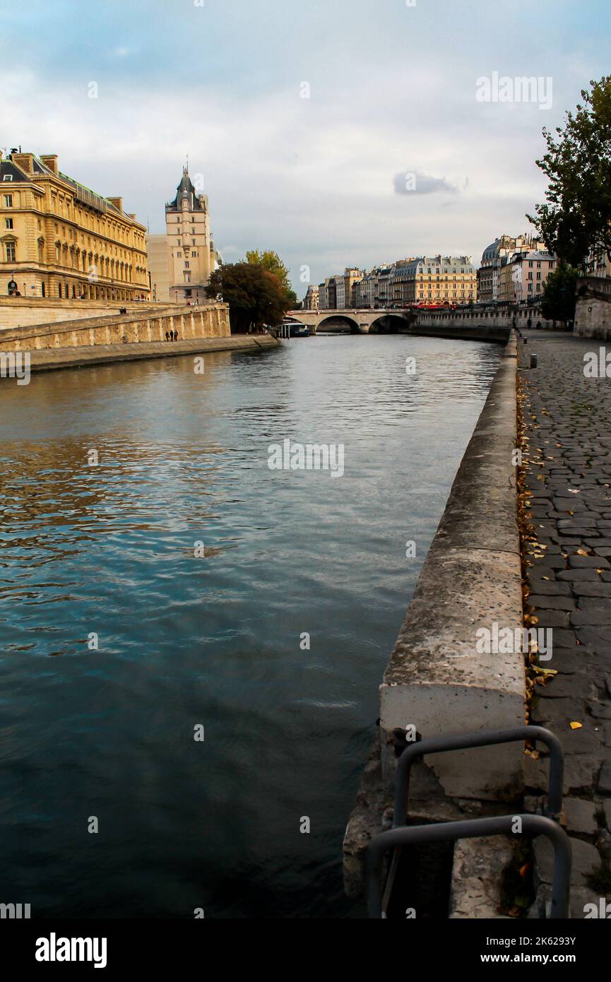 A vertical of the Seine river and a bridge above it in Paris, France ...