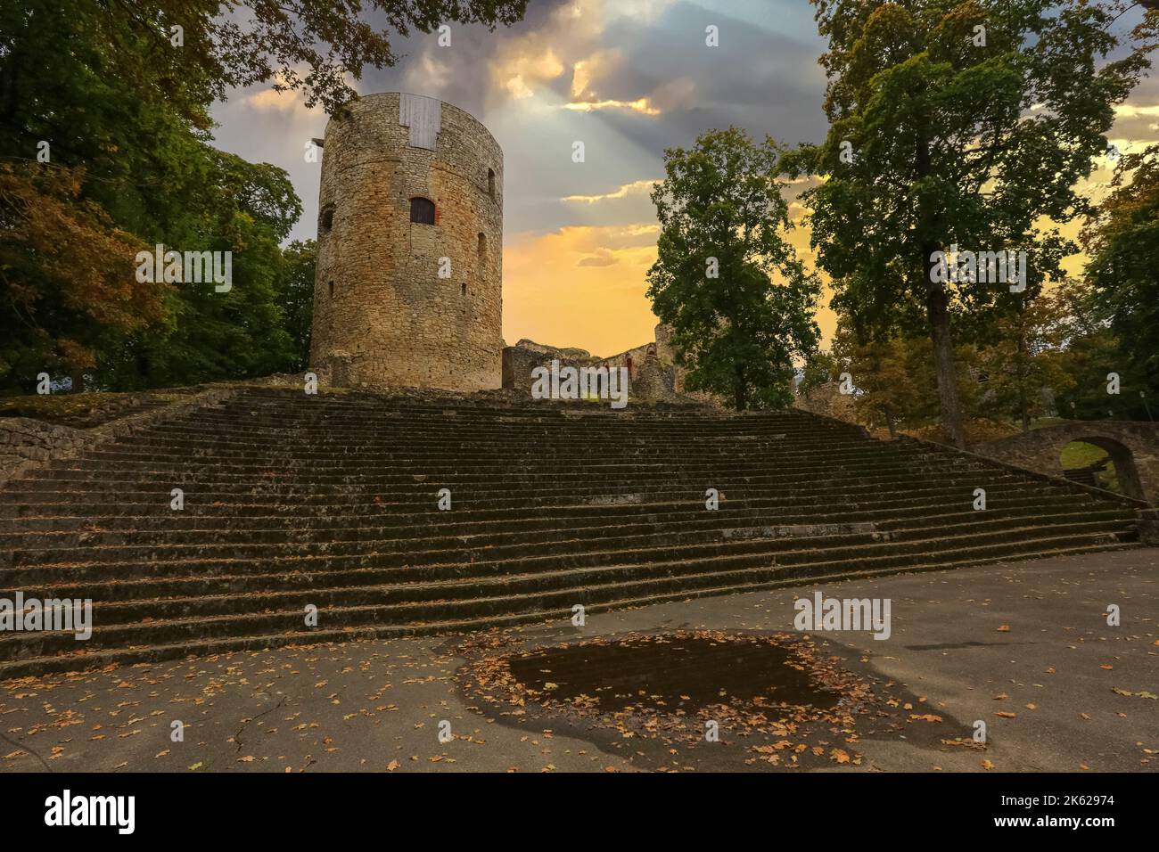 Autumn park and abandoned medieval castle in the town Cesis which has ...