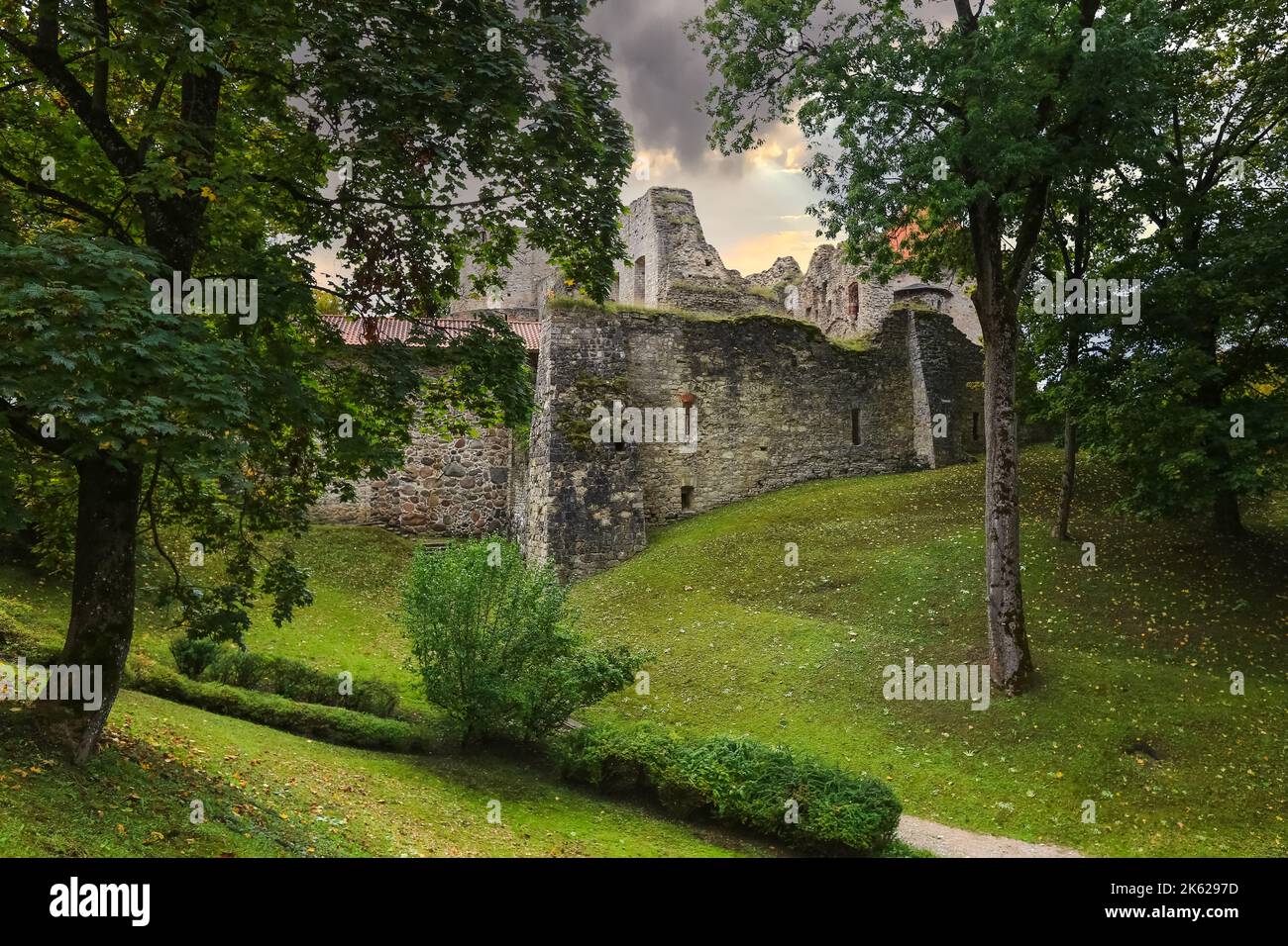 Autumn park and abandoned medieval castle in the town Cesis which has ...