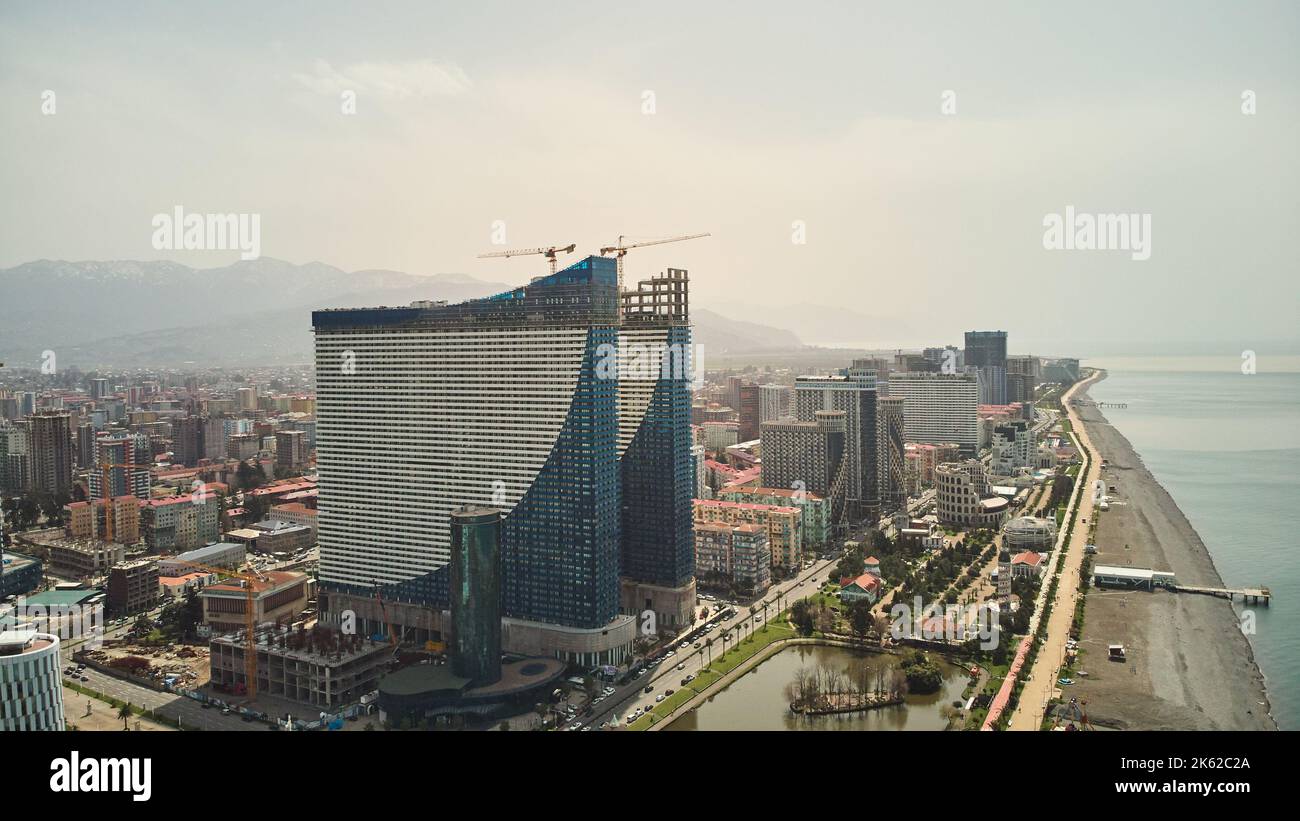 Aerial view of the modern architecture of Batumi with mountains ...