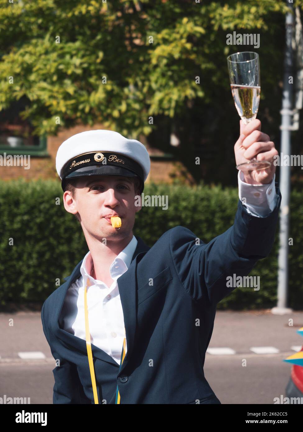 A newly graduated Swedish student celebrating his high school ...