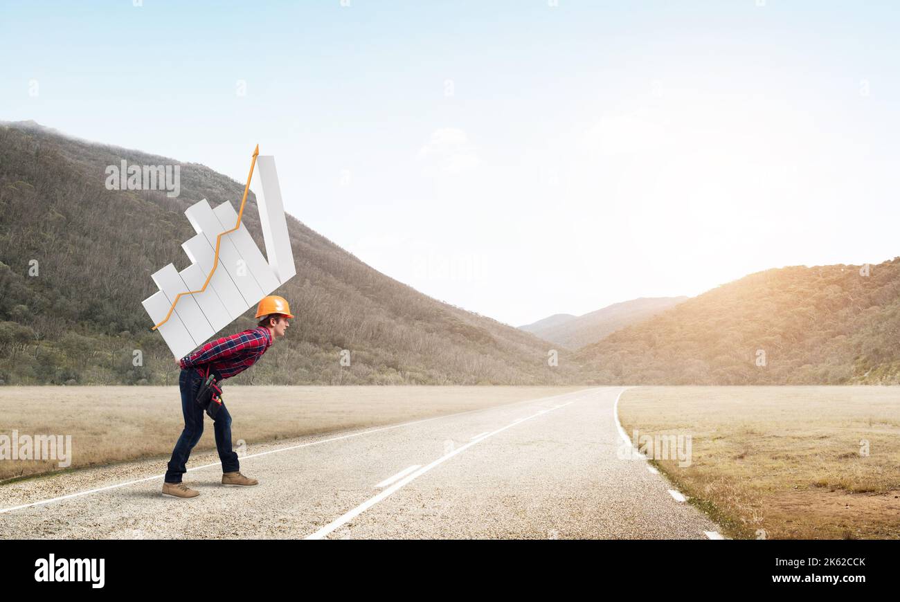 Engineer man carry progress graph Stock Photo - Alamy