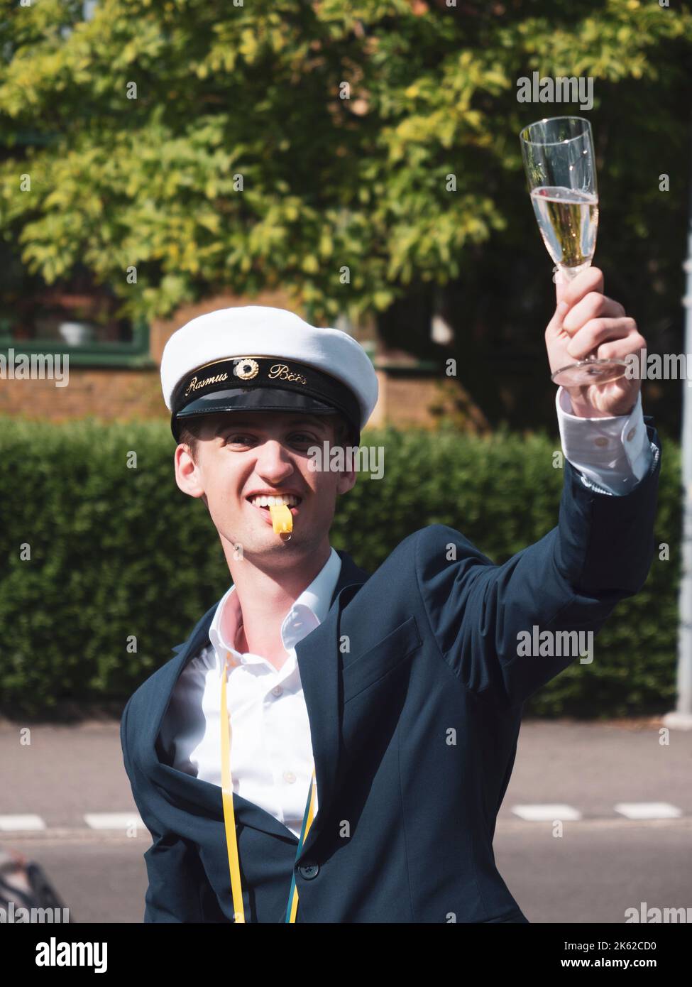A newly graduated Swedish student celebrating his high school ...