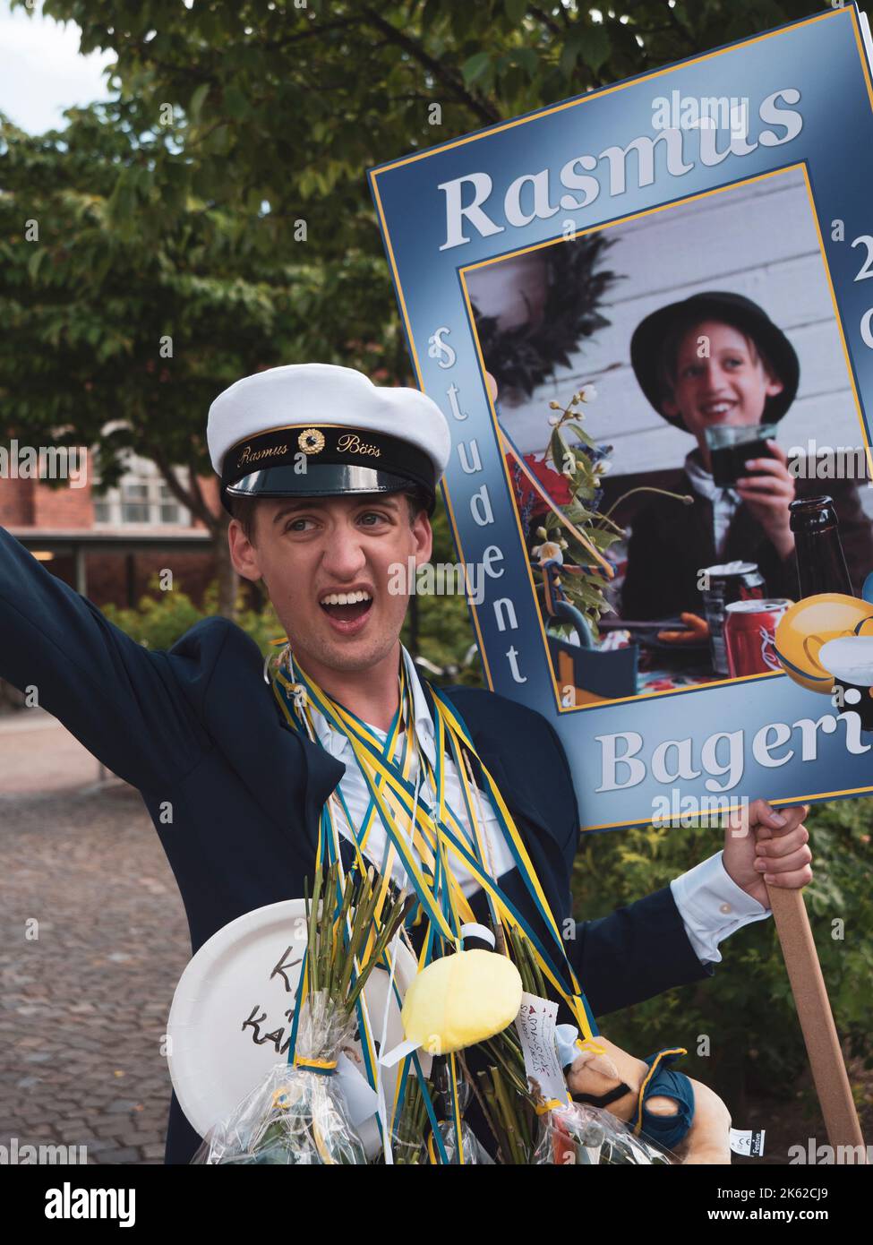 A newly graduated Swedish student celebrating his high school ...