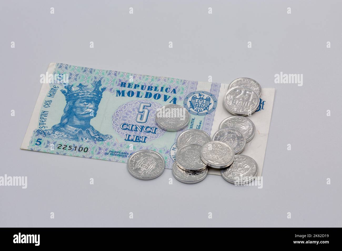 closeup on white coins and paper money of Moldova with portrait of ...