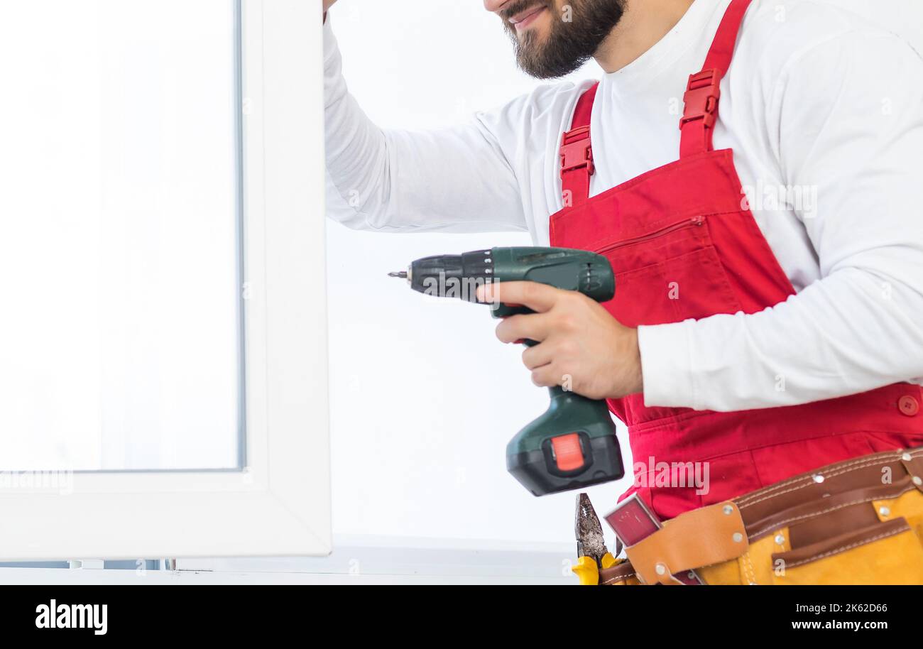 Man with screwdriver. Clouseup concept Stock Photo - Alamy