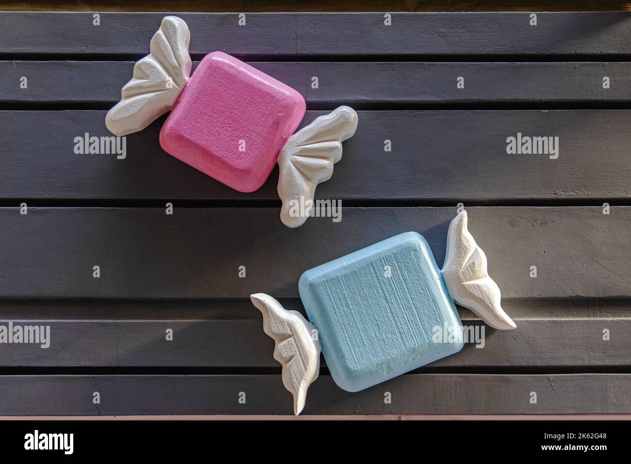 Two Candies Wrap Shape 3d at Building Wall Stock Photo - Alamy