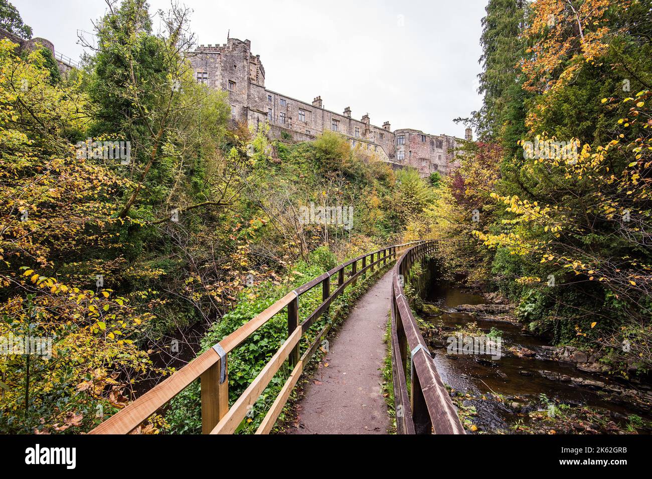 Skipton Castle, from the footpath walkway to Skipton Woods, displaying ...