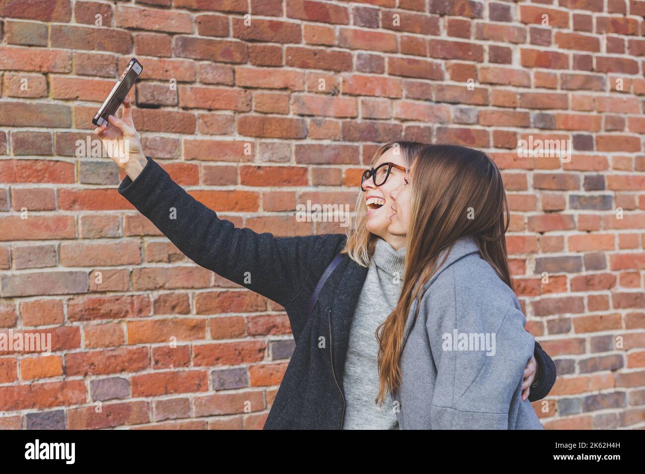 Two hipster girlfriends taking a self photo for social networks in ...