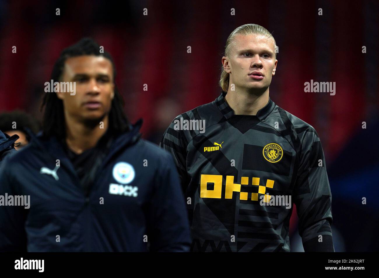Manchester City's Erling Haaland (right) makes his way to the bench ...