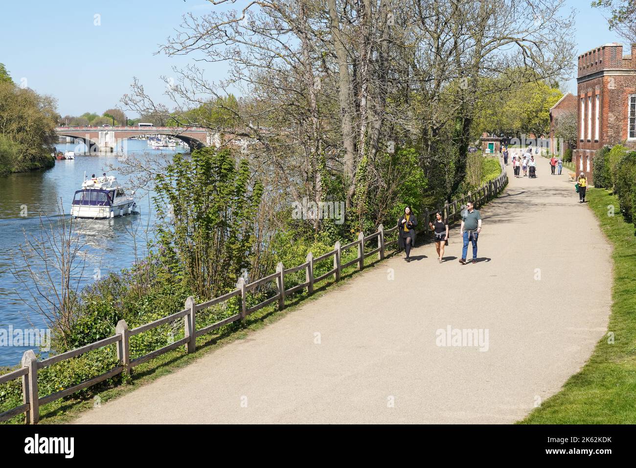 People enjoying sunny spring day on Thames path in Hampton, Richmond ...