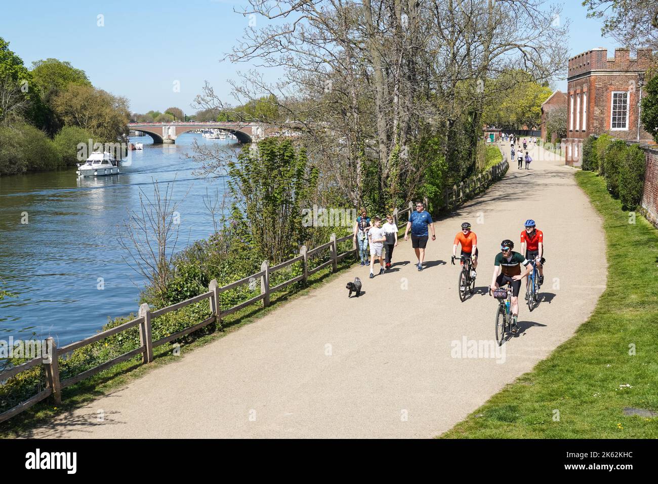 People enjoying sunny spring day on Thames path in Hampton, Richmond ...