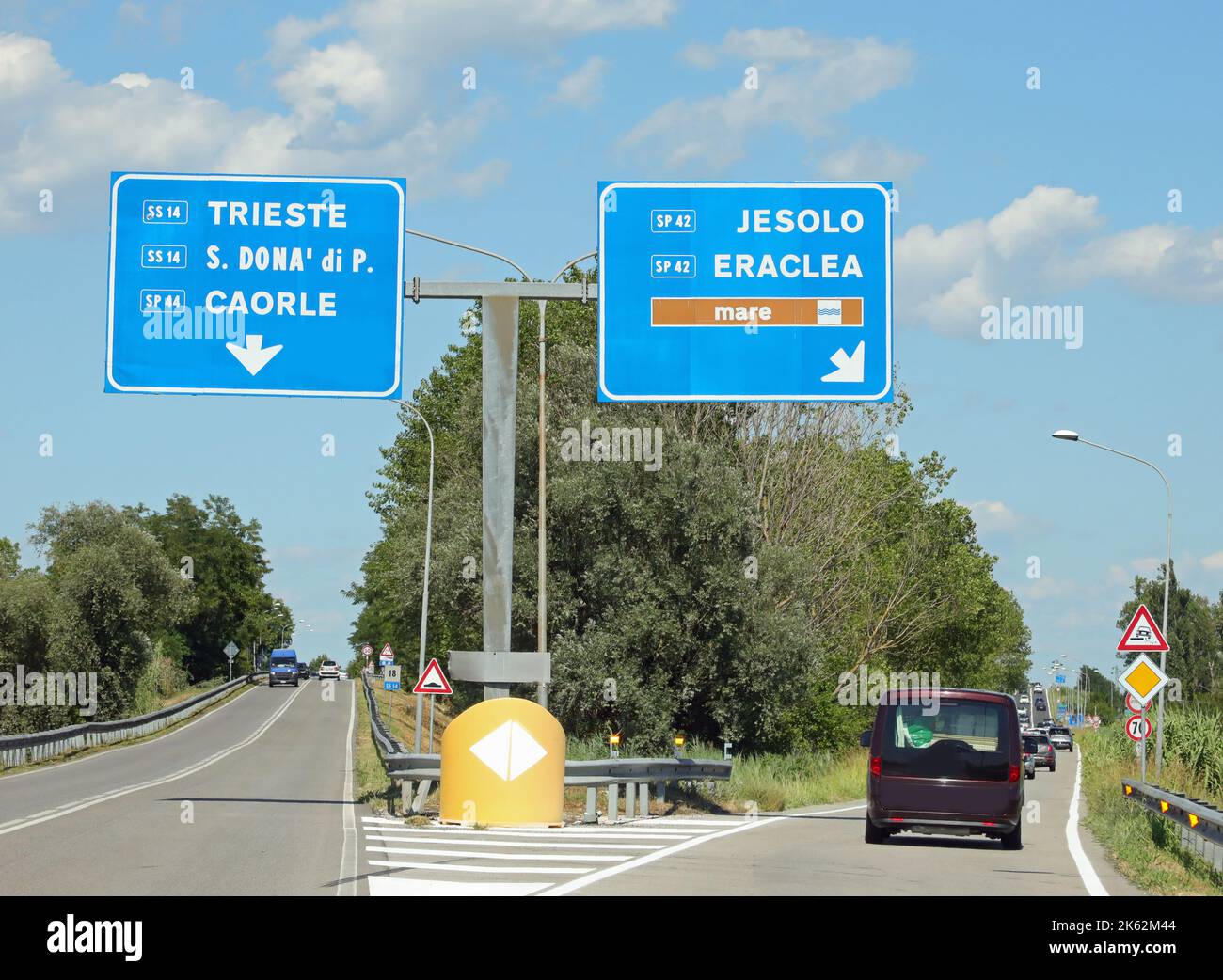 road signs at the crossroads with ITALIAN LOCALITIES written in large ...