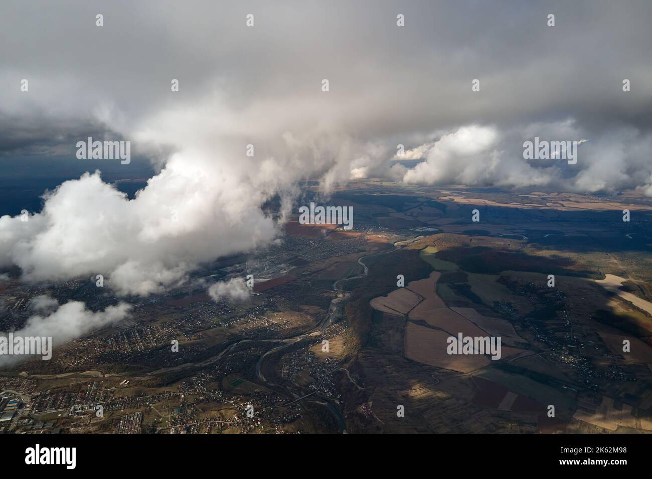 Aerial view from airplane window at high altitude of earth covered with ...