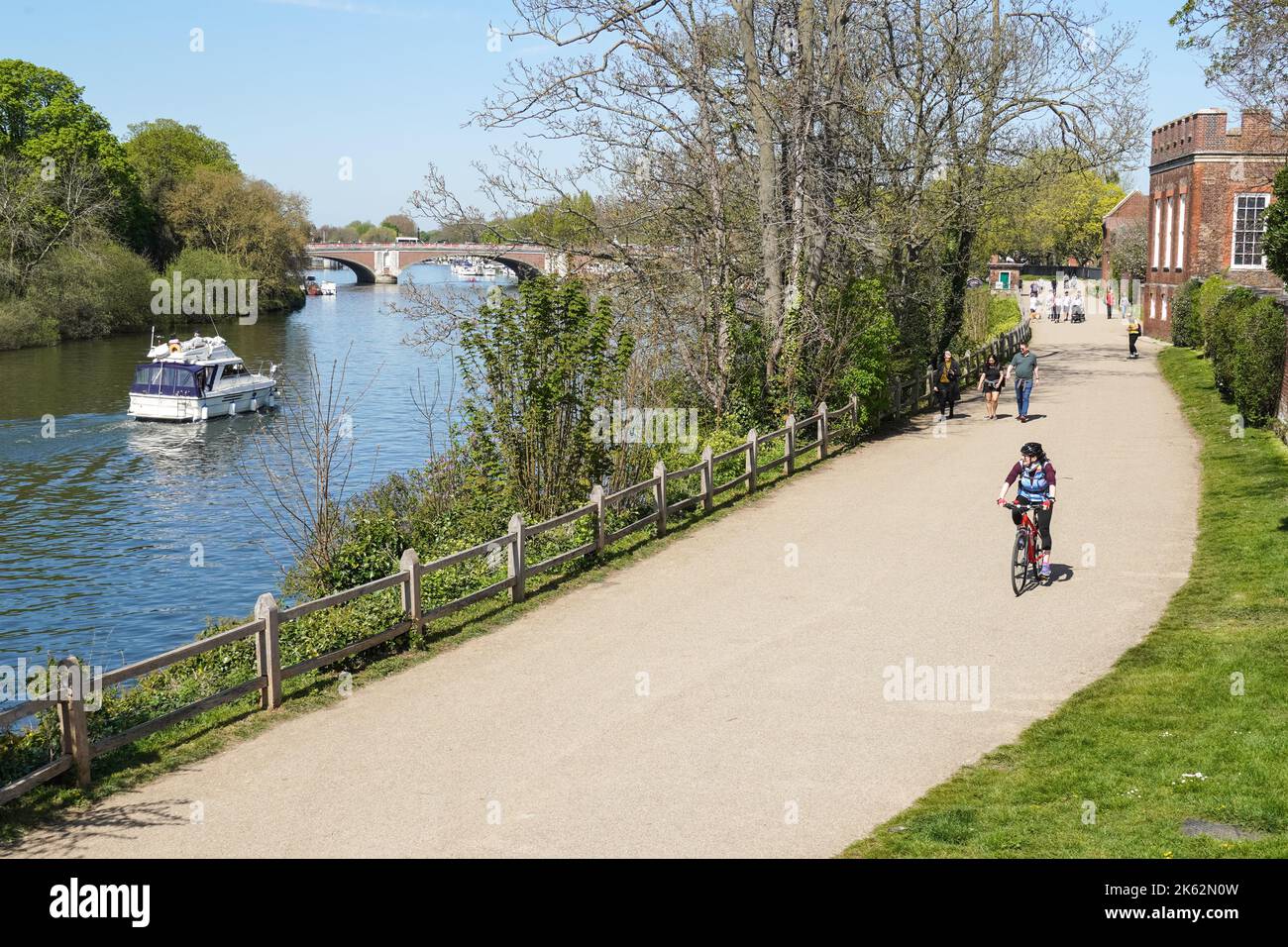 People enjoying sunny spring day on Thames path in Hampton, Richmond ...