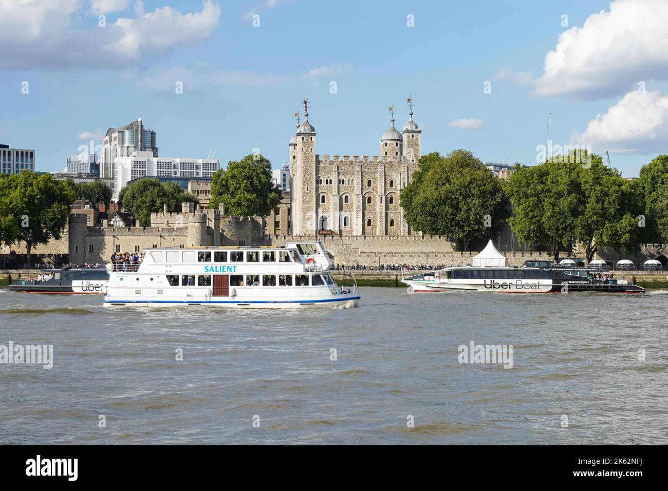 Thames clipper, Uber Boat passing the Tower of London on the River ...