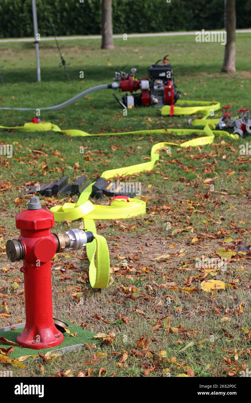 fire hydrant with brightly colored hose during a firefighting drill ...