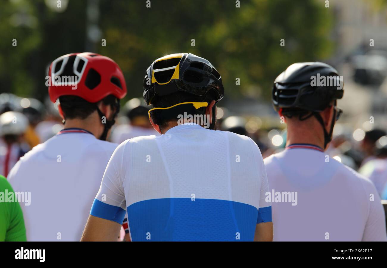 head of a cyclist with protective helmet at the start of a cycling race ...