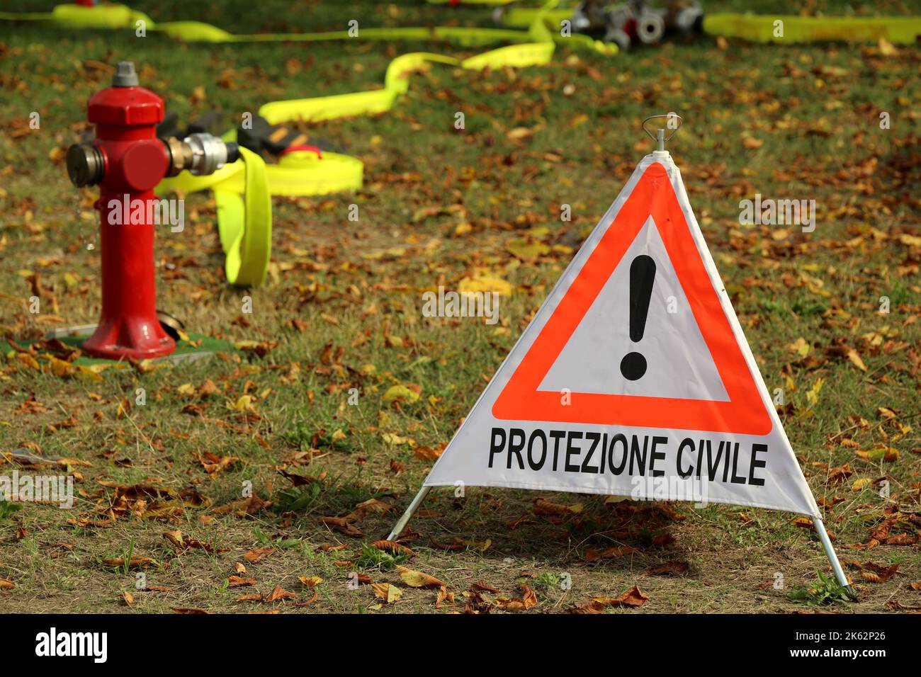 big triangle with exclamation mark and text in Italian which means ...