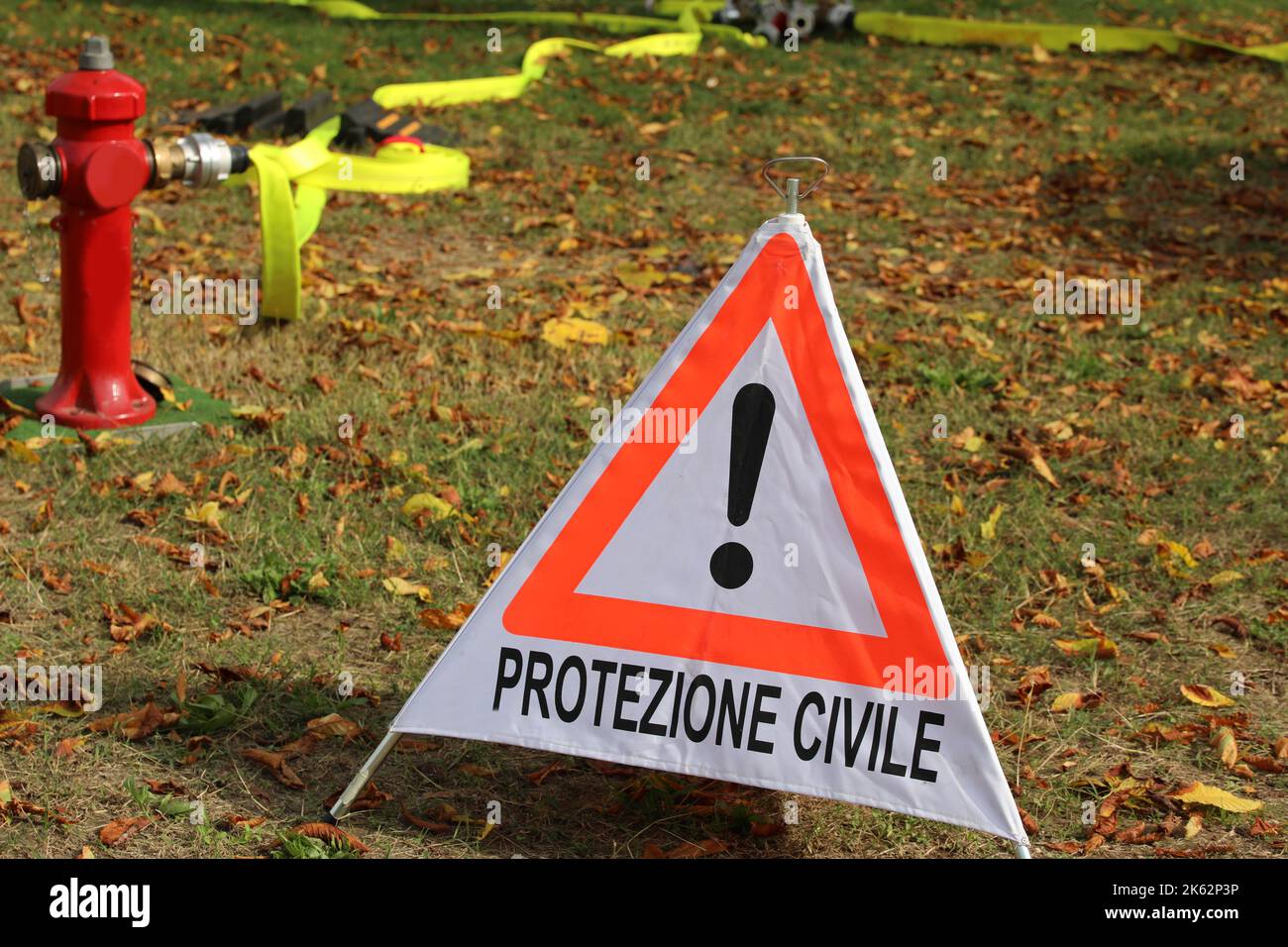 big triangle with exclamation mark and text in Italian which means ...