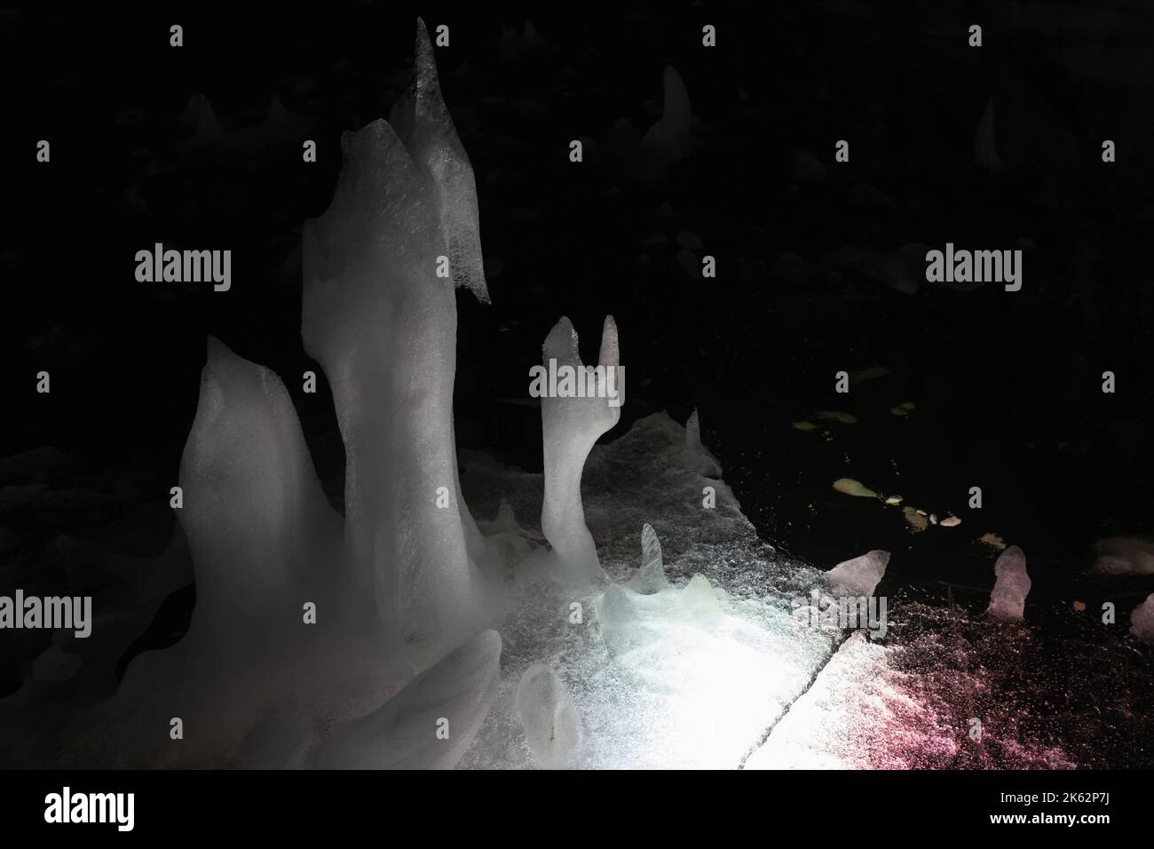 Melting ice staligmites in the abandoned underground marble quarry of ...