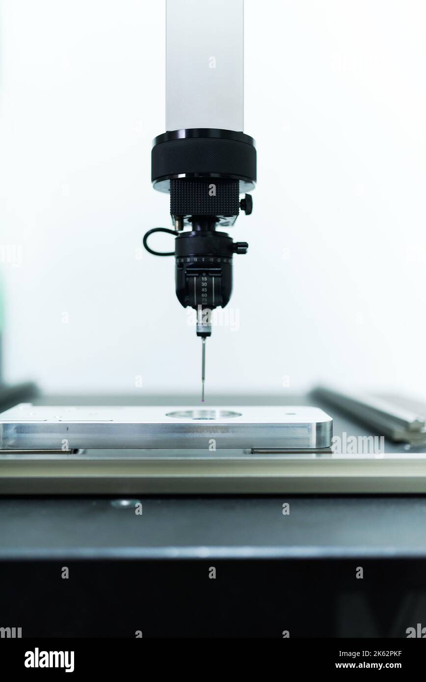 A vertical shot of a CMM inspection after the machining process in an ...