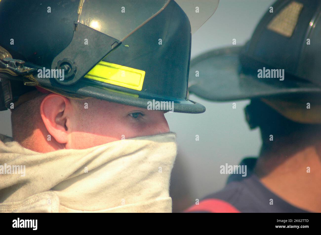 Firemen fighting a small brush fire in the Atlanta area with water and ...
