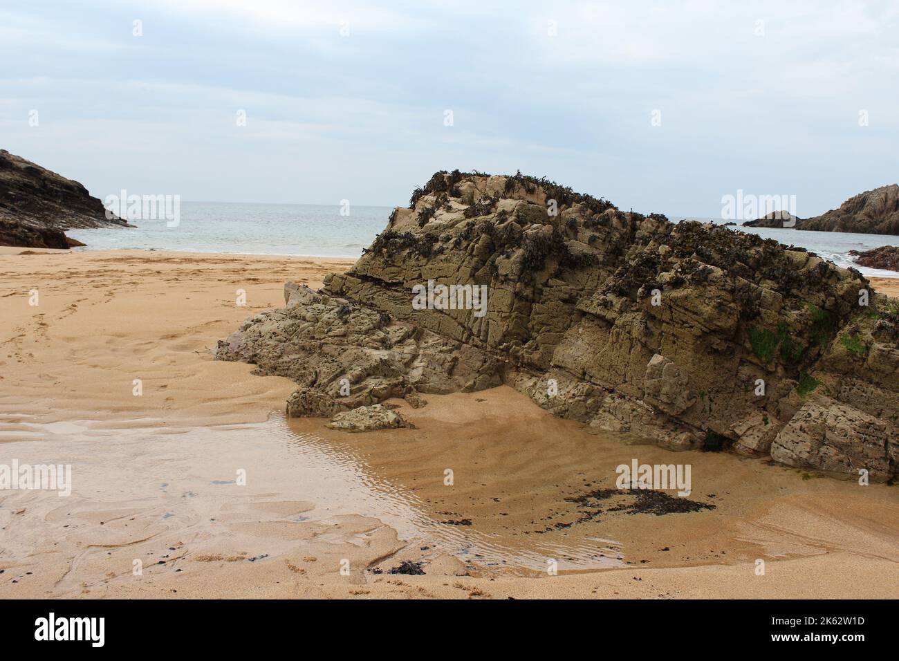 A beautiful shot of a rock in the Murder Hole Beach in Donegal, Ireland ...