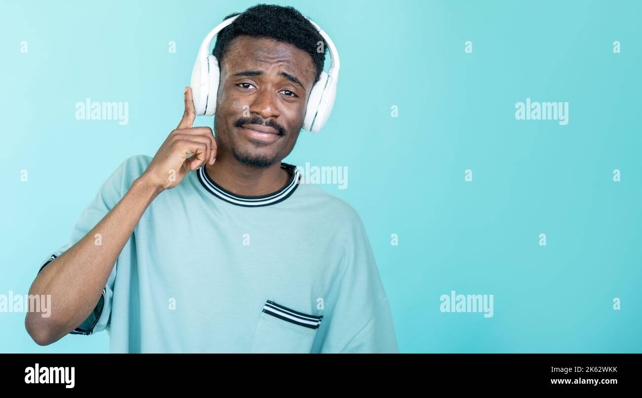 bad sound unhappy man stereo technology skeptic Stock Photo - Alamy