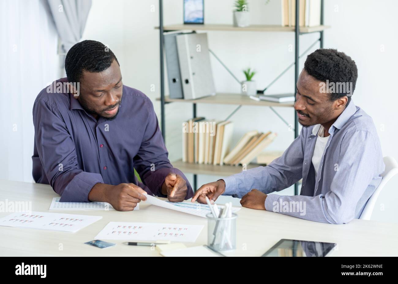 Male female work team discussing hi-res stock photography and images ...