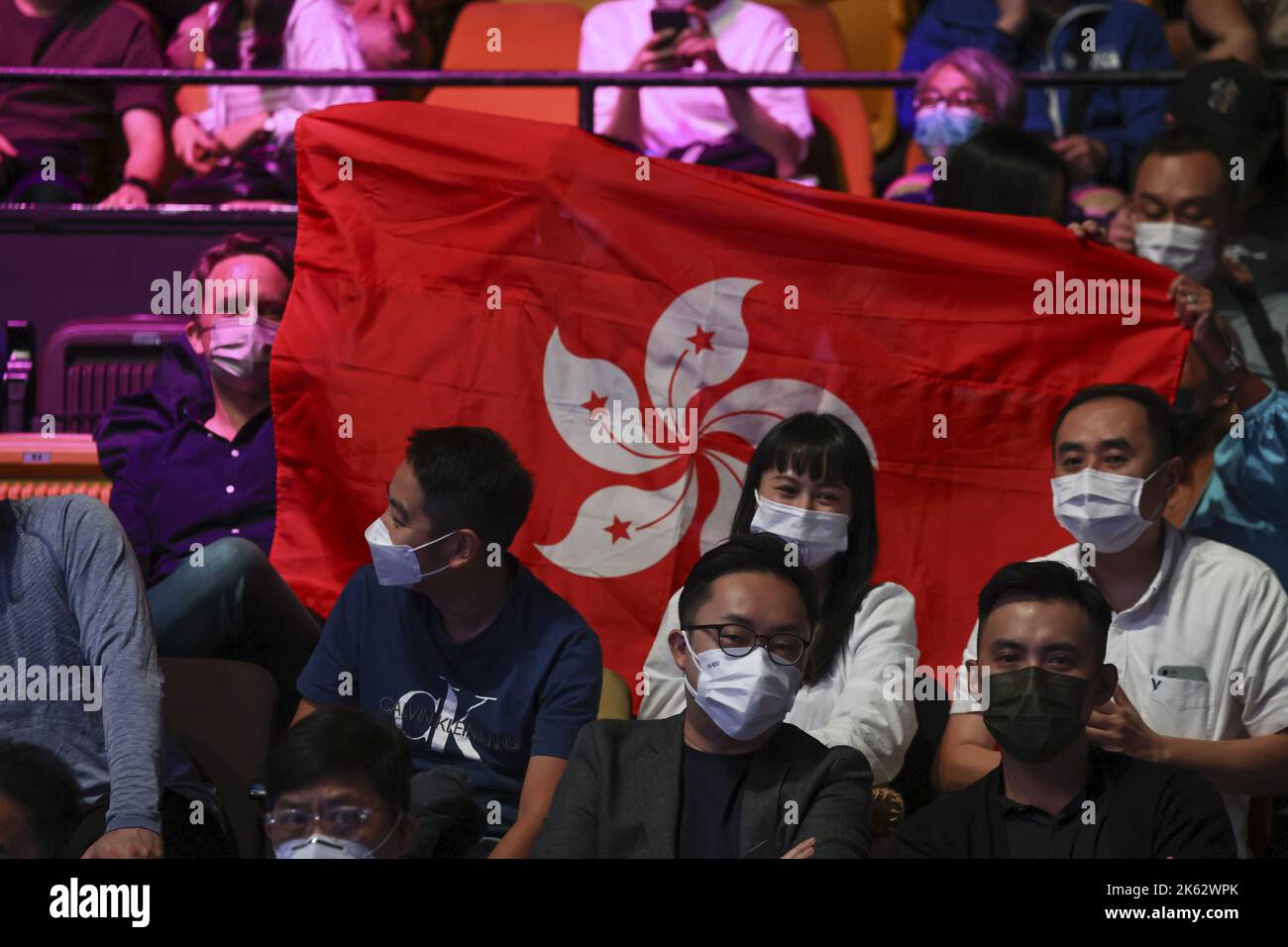 Audience members hold a Hong Kong SAR flag during the game between Hong ...
