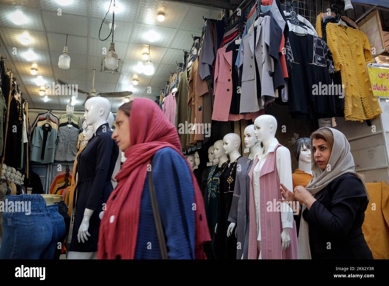 Shiraz, Fars, Iran. 9th Oct, 2022. Iranian women walk past in a street ...