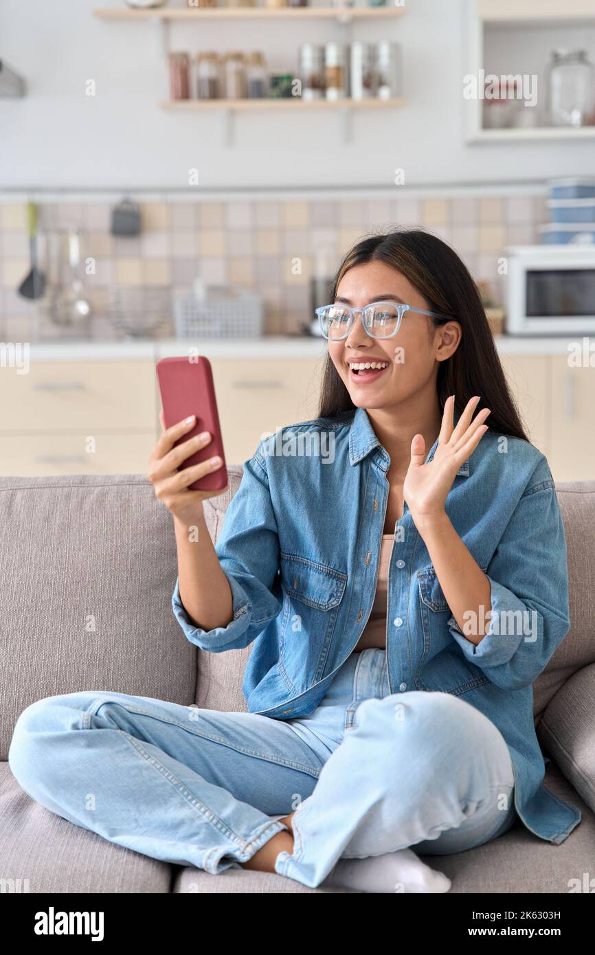 Young asian woman making video calling with smartphone at home Stock ...