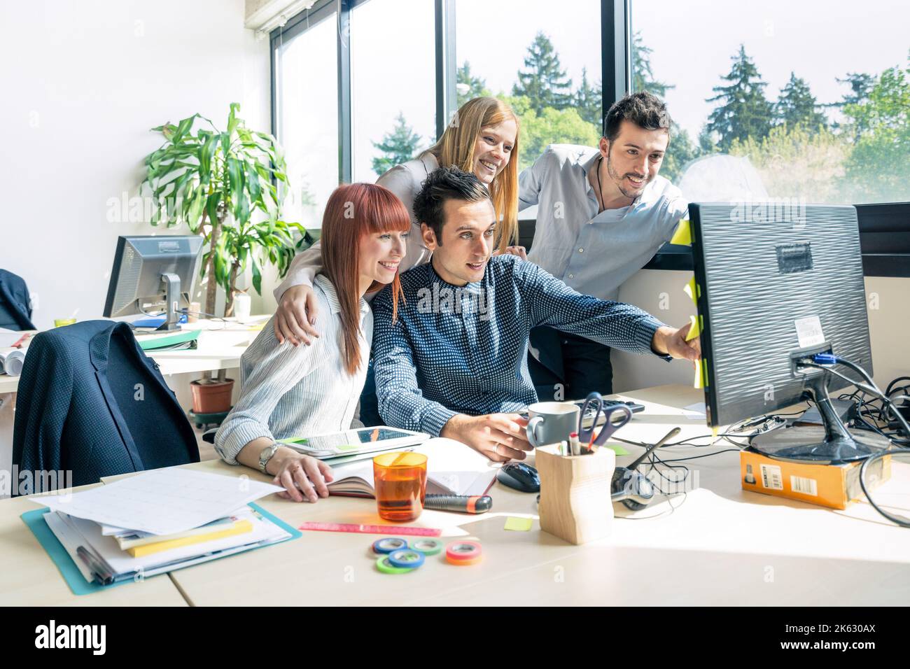 Group of young people employee workers with computer in urban ...